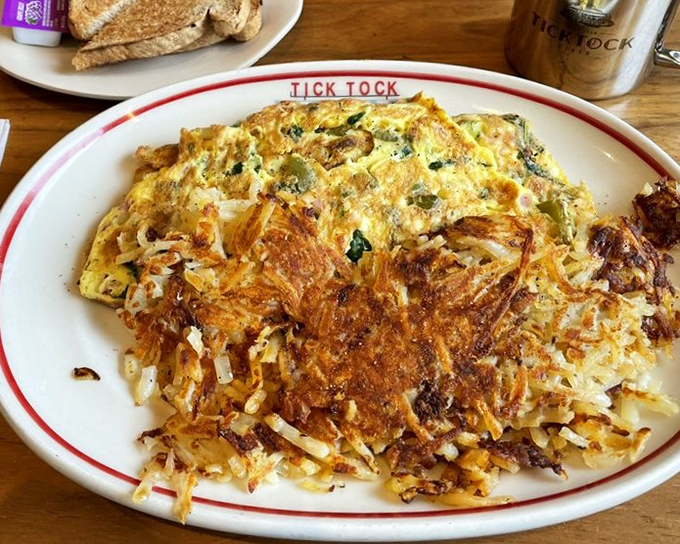 This isn't just an omelet&mdash;it's a golden canvas where hash browns and eggs perform a delicious duet that's worth getting out of bed for.