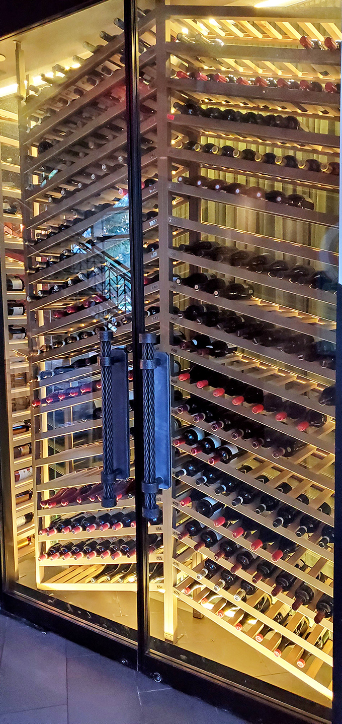 This wine display isn't storage&mdash;it's a temperature-controlled gallery of liquid art. Each bottle waits patiently for its moment to shine.