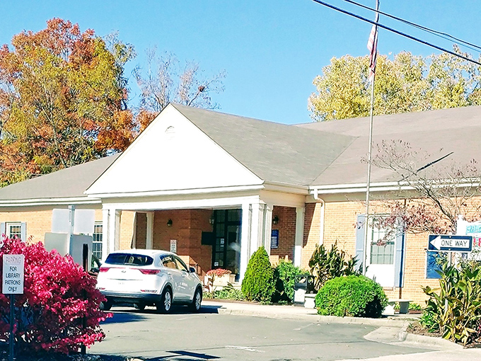 The Wythe County Library welcomes readers with a modest entrance and vibrant landscaping&mdash;proof that literary adventures remain one of retirement's best bargains.