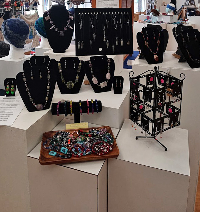 Handcrafted jewelry displays showcase unique pieces that whisper "treat yourself" to passing shoppers seeking something special.