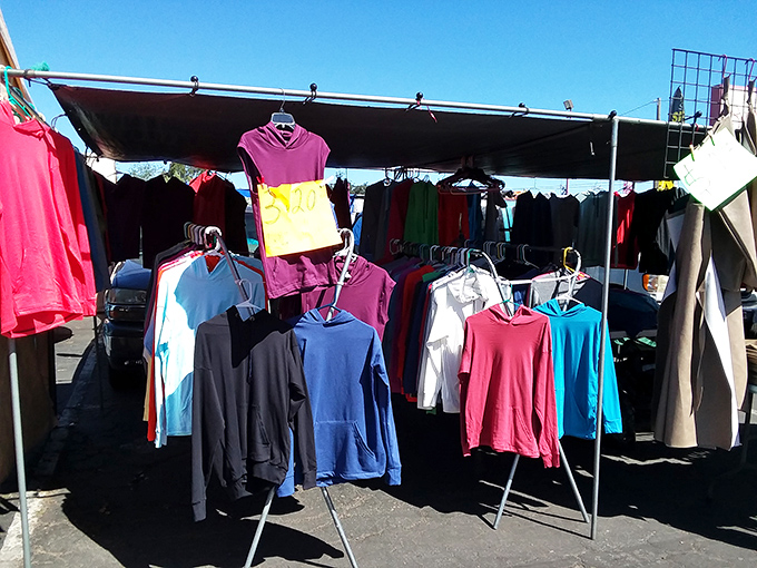 Simple racks under blue skies showcase everyday fashion &ndash; proof that style doesn't need marble floors or fancy lighting.