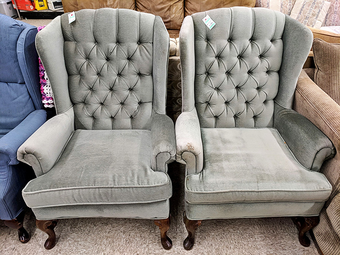 Twin wingback chairs that look like they once hosted serious conversations about mortgage rates and martini recipes.