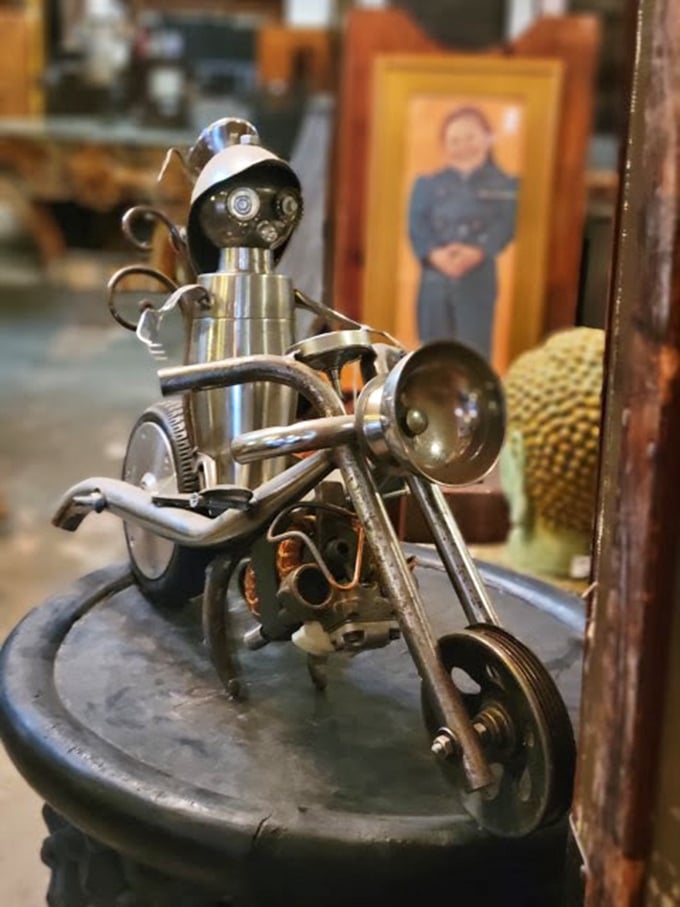 Someone crafted this metal motorcycle with the kind of attention to detail that would make Michelangelo jealous of metalwork.