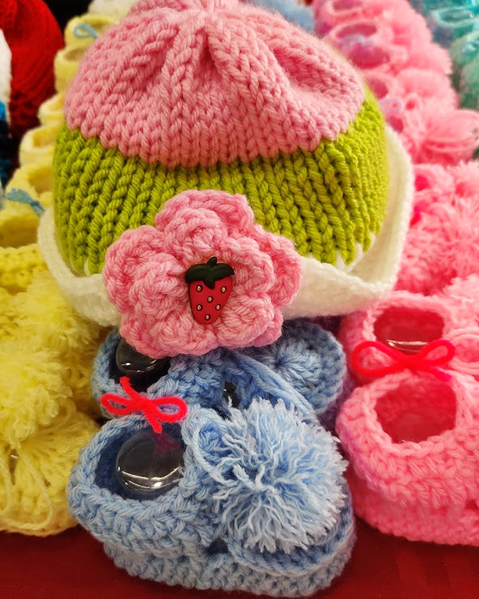 Cowboy boots lined up like Texas royalty, each pair telling a different story and waiting for the right feet to continue their journey.