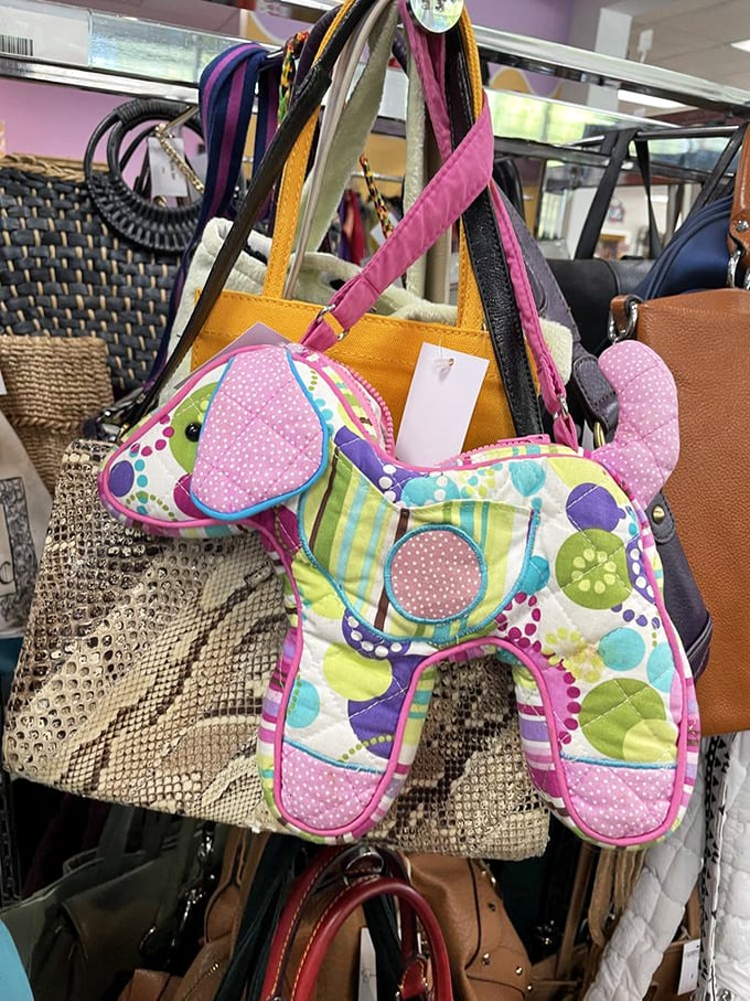 This patchwork puppy purse isn't just an accessory—it's an instant mood-lifter hanging among sophisticated leather companions, waiting for its forever home.