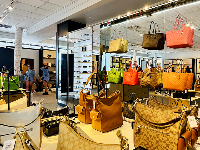 A rainbow of designer handbags stands ready for adoption. Your existing collection whispers, "Make room for me," from miles away.