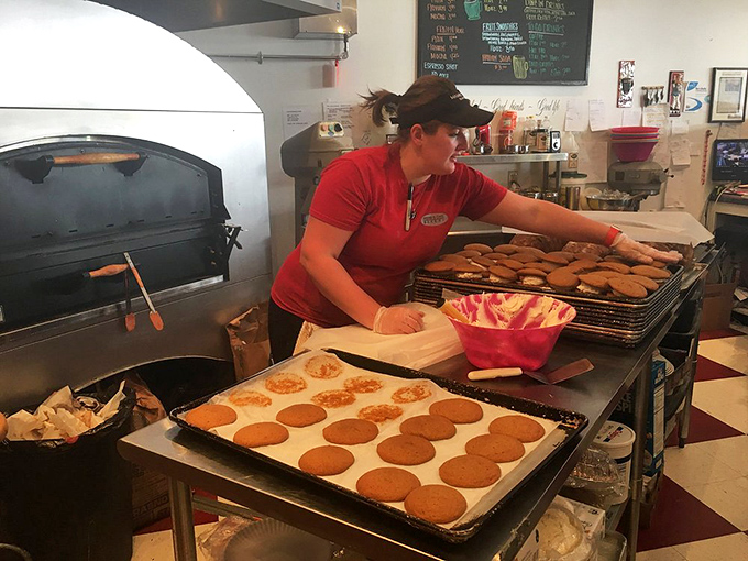 Behind the scenes magic where dough becomes dreams. The brick oven is the unsung hero of Mamie's legendary baked goods.