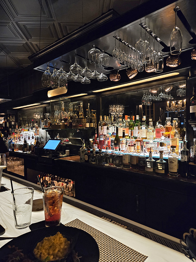 The bar doesn't just serve drinks; it showcases liquid art with a backlit display that makes choosing your poison a delightful dilemma.