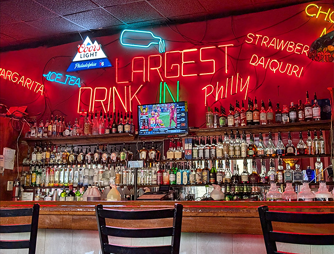 "Largest Drink in Philly" isn't just neon bragging—it's a challenge. The bar side of Max's offers liquid courage before tackling their massive sandwiches.