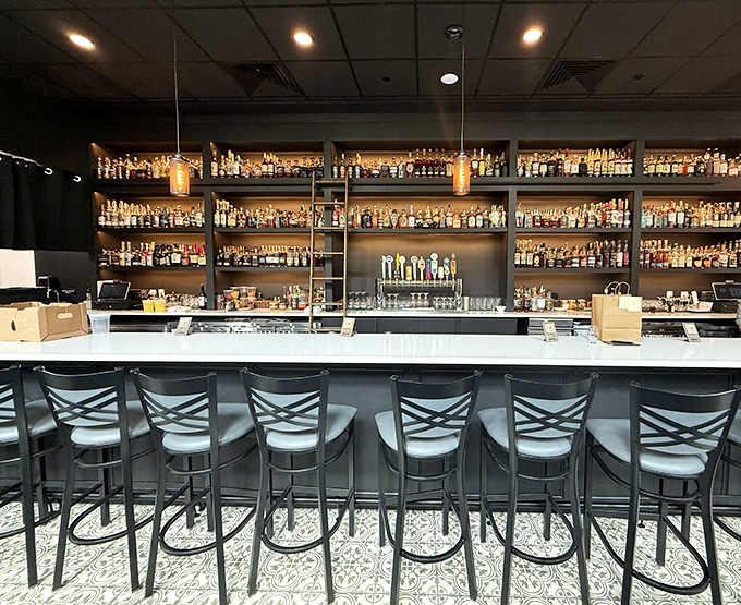 A bar backed with enough bottles to make even the most indecisive drinker find their perfect match. It's like an adult candy store, but better.