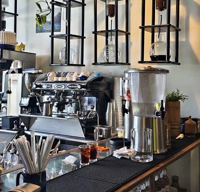 The coffee bar setup looks like a science lab dedicated to the pursuit of caffeine perfection. Beakers and equipment promise liquid gold.