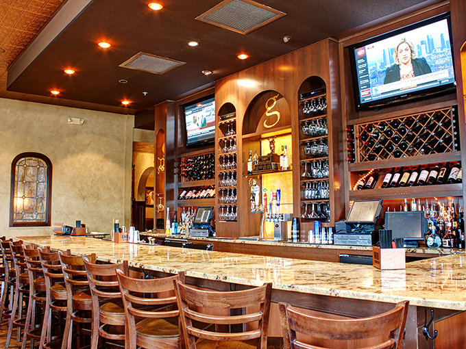 The bar at Giammarco's&mdash;where wine bottles stand at attention like soldiers guarding the gateway to a night of poor decision-making and excellent eating.