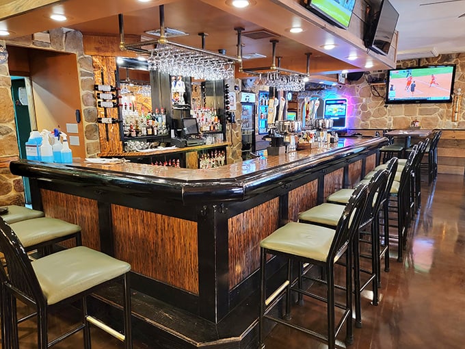 The bar beckons like a siren song, promising cold drinks and the kind of conversations strangers become friends over.