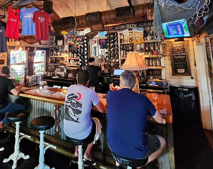 The bar where strangers become friends over cold beers and fish tales that grow bigger with each round.