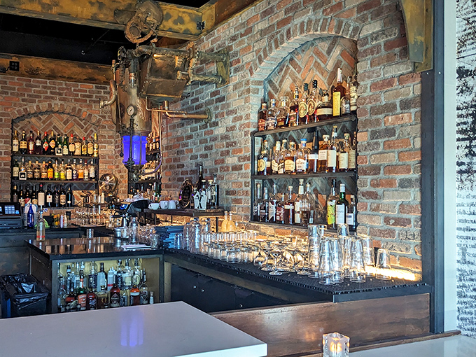 The bar area combines exposed brick, industrial elements, and enough premium spirits to make prohibition weep with regret.