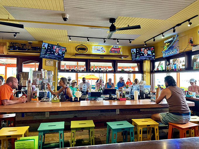 The bar isn't just serving drinks; it's serving community&mdash;a colorful gathering spot where strangers become friends over grouper tales and rum runners.