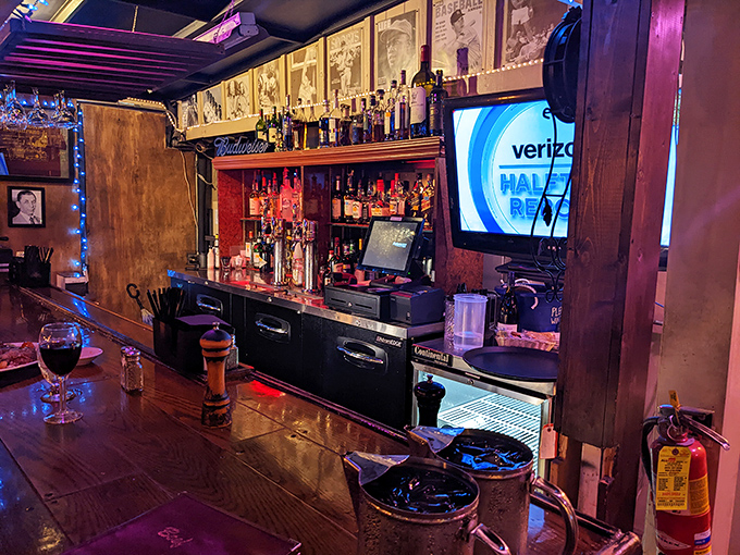 The bar stands ready to pour liquid accompaniments to your carnivorous feast, a shrine to proper cocktail craftsmanship.
