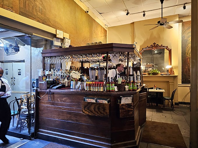 The bar isn't just serving drinks; it's dispensing liquid history with each pour of Sazerac or Ramos Gin Fizz.