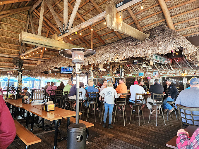 The outdoor deck offers the kind of genuine Florida experience that theme parks try to replicate but never quite capture.