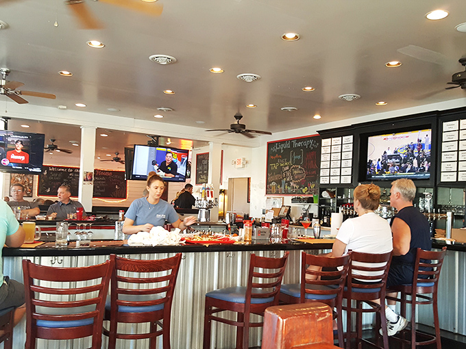 The bar&mdash;where seafood stories get taller and cocktails flow like the tide. Those stools have heard more fish tales than a marine biologist's diary.