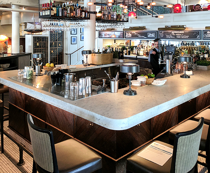 A bar that promises proper cocktails - gleaming surfaces, organized chaos, and the silent invitation to pull up a stool and stay awhile.