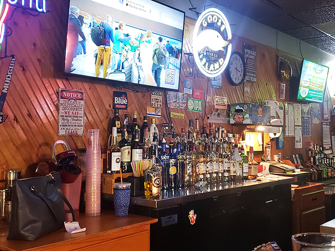 The bar gleams with promise under the glow of neon beer signs&mdash;bottles standing at attention like sentinels guarding good times.