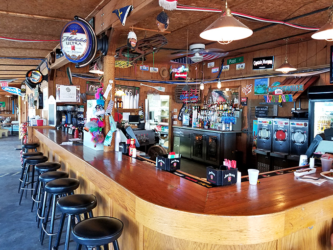 A bar that understands its mission: cold drinks, warm conversations, and enough nautical decor to remind you you're lakeside.