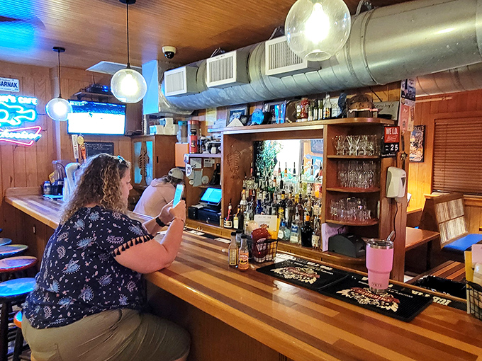 The bar at Frenchy's &ndash; where locals and tourists alike find common ground in cold drinks and seafood cravings. Those bottles stand ready like soldiers awaiting delicious deployment.