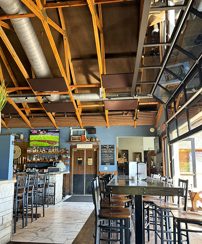 The bar area invites lingering conversations where craft beers flow and strangers become friends over shared plates and Springfield stories.