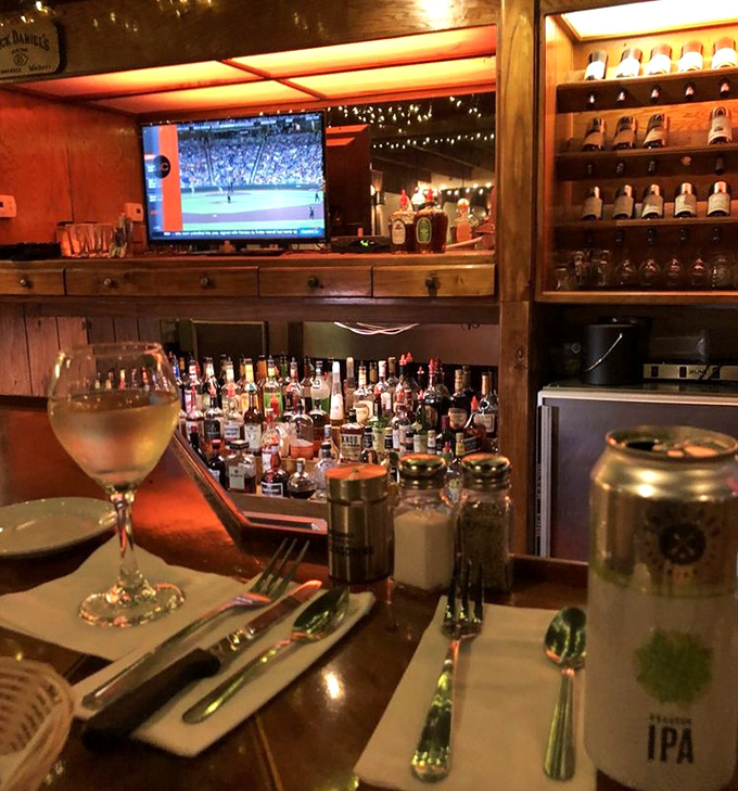 A bar that understands its purpose: good drinks, sports on TV, and the promise of steak just steps away.