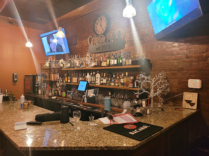 A bar stocked with enough spirits to raise your own – the perfect perch to sample a cocktail while waiting for that legendary fried chicken.