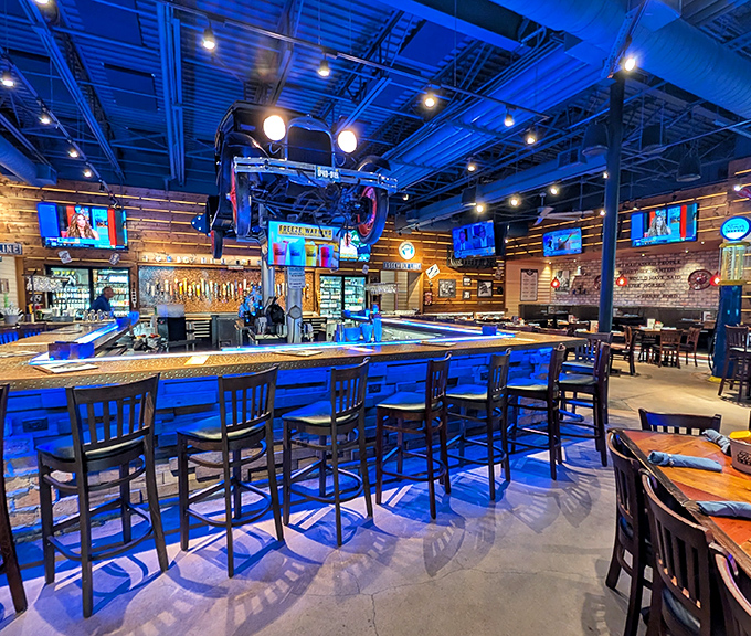 Bar seating that puts you in the driver's seat. The wraparound counter offers prime viewing of both the suspended cars and the craft beer selection.