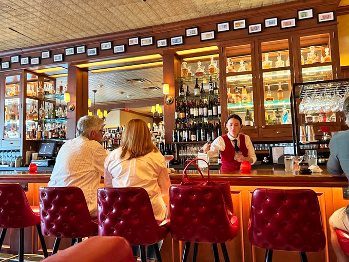 Behind that gleaming bar, bottles stand at attention like soldiers guarding liquid treasures for your evening's enjoyment.