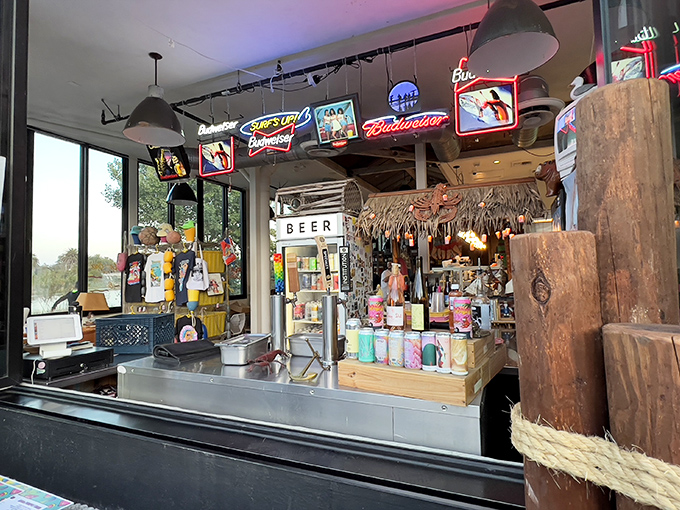The bar area glows with neon signs and coastal charm, creating the perfect spot to belly up for a cold one while waiting for your seafood feast to arrive.