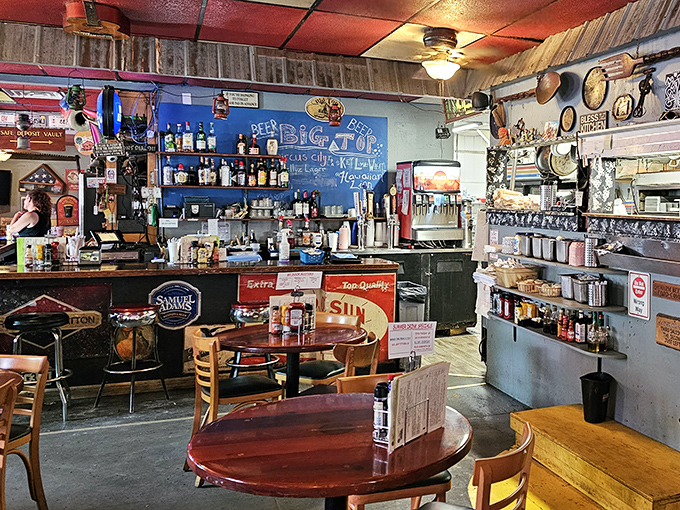 Behind the bar, vintage signs and bottles create a backdrop worthy of your favorite neighborhood gathering spot.