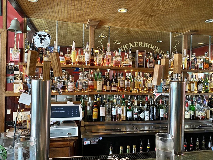 Behind this bar, bottles stand like soldiers ready for duty, promising libations that pair perfectly with that legendary fish and chips.