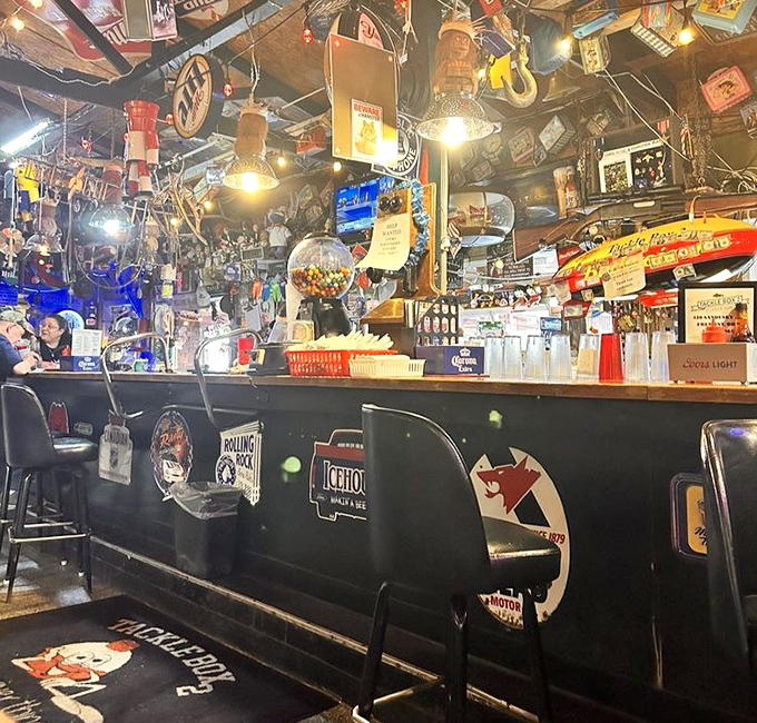 The bar area feels like the command center of a particularly festive fishing vessel. Every stool tells a story.