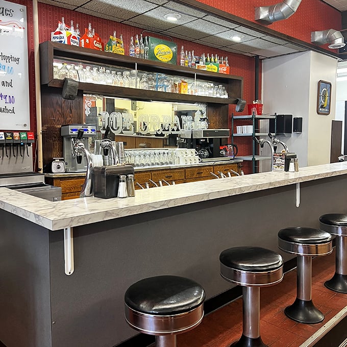 The soda fountain counter&mdash;where magic happens one milkshake at a time. Those stools have supported generations of sweet-toothed dreamers. 