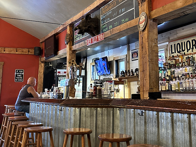 The bar where barbecue stories are exchanged like currency. Notice the corrugated metal – practical and somehow exactly right for this temple of smoke.