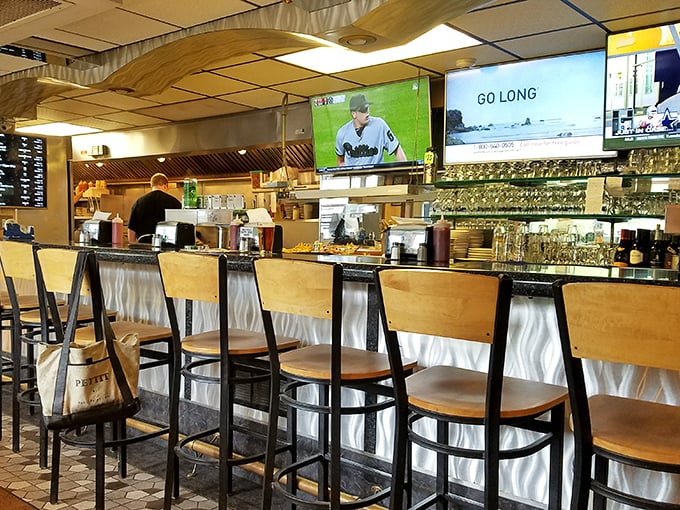 The bar area: where sports on TV and pizza conversations create that perfect neighborhood symphony of contentment.