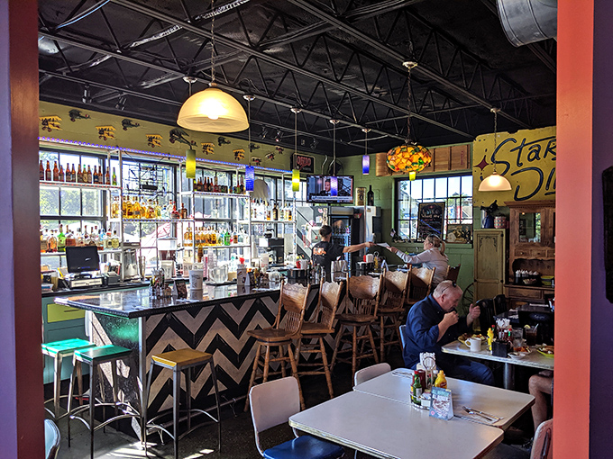 The bar's zigzag pattern and backlit bottles create a retro-futuristic vibe that says, "The cocktails here might just beam you up."