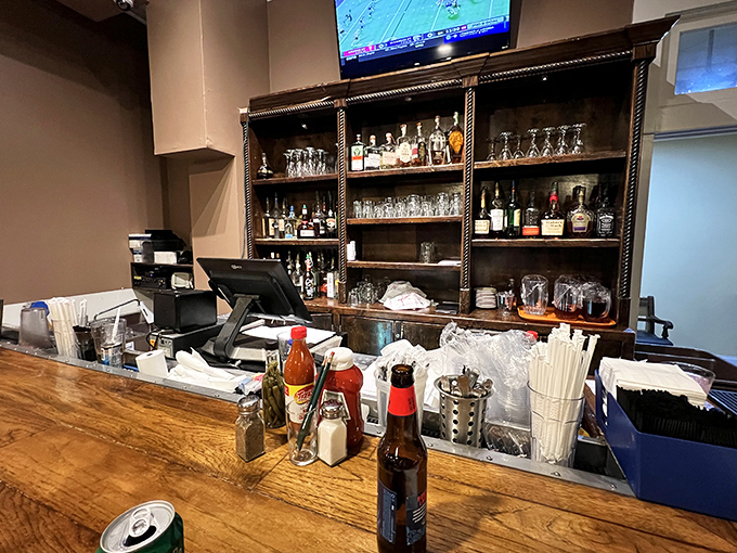The bar area stands ready to quench thirsts with Southern libations—because nothing pairs with comfort food like a properly mixed cocktail.