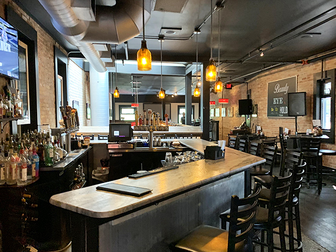 The bar isn't just where drinks are poured – it's command central for an evening of Michigan craft beer exploration and burger anticipation.