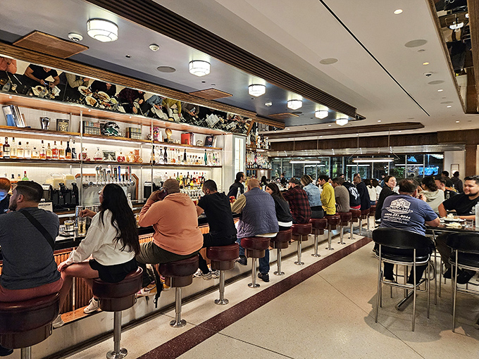 The bar at Tops isn't just a place to sit&mdash;it's front-row seats to culinary theater, where cocktails and conversation flow with equal enthusiasm. 