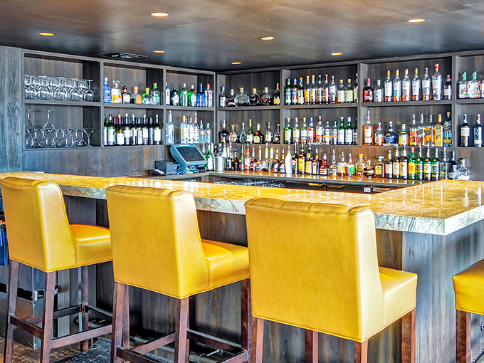 A bar that says "pull up a chair and stay awhile." Those mustard-yellow seats practically demand you order something shaken, not stirred.