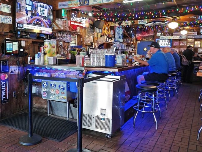 The bar where stories flow as freely as the drinks. Those stools have supported generations of seafood enthusiasts and their satisfied appetites.