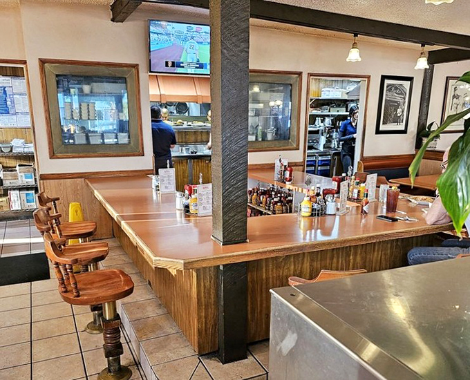 Counter seating: where solo diners become temporary family. Watch the kitchen ballet while nursing your coffee and contemplating a second slice of pie.