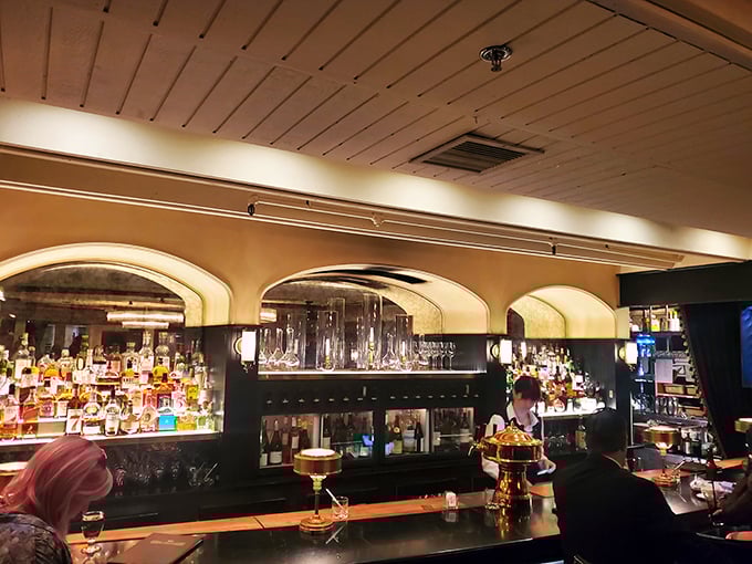 A bar stocked like a liquid library, where bartenders are both scholars and artists. Your perfect Manhattan awaits.