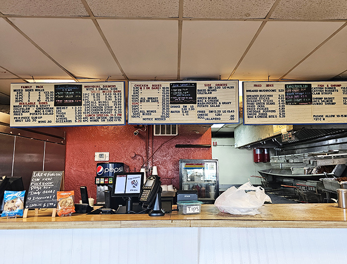 The command center where chicken dreams come true. Behind this counter, ordinary poultry transforms into extraordinary memories.