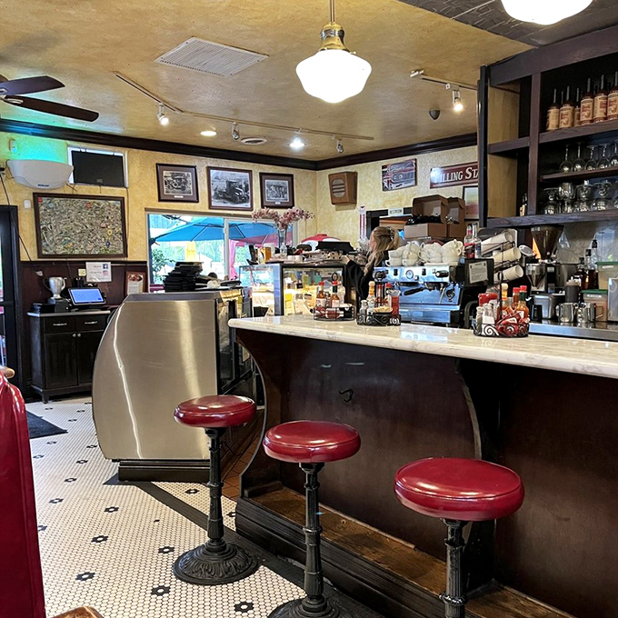 The counter beckons early birds with its classic red stools&mdash;the perfect spot to sip coffee and watch breakfast magic unfold.